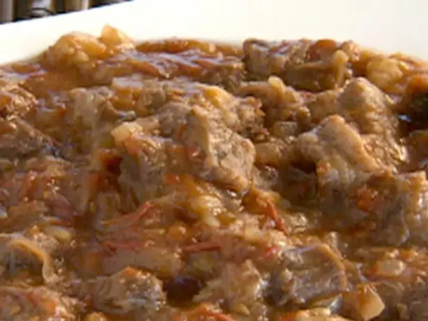 Goat Stew Recipe | Robert Irvine | Food Network