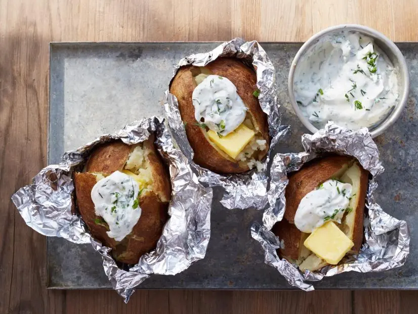 Camping Baked Potatoes with Herbed Sour Cream Recipe | Guy Fieri | Food ...