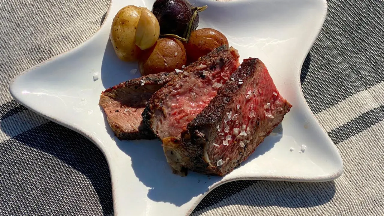 Fire Pit Steak and Potatoes Recipe | Michael Symon | Food Network