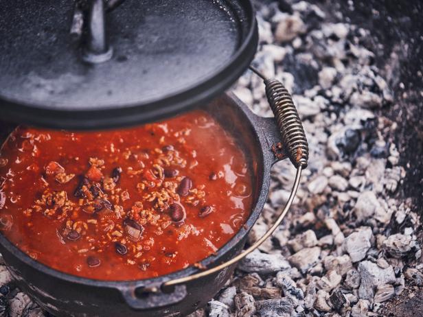 How to Cook Food Over a Campfire | Cooking School | Food Network