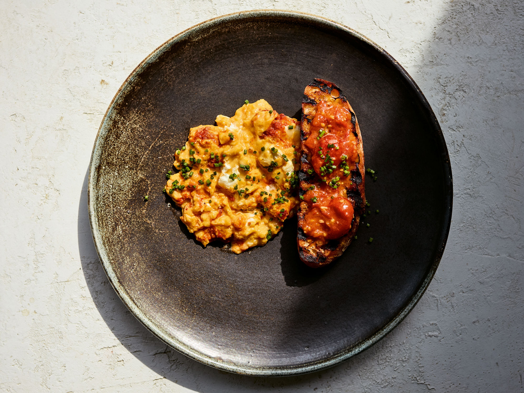 Scrambled Eggs with Almond Romesco, Bucheron Cheese, and Tomato Confit ...